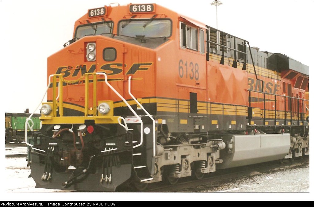 BNSF 6138 at BNSF Lincoln Motor Works close up of conductors left side of unit.
